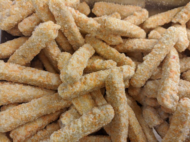 A Collection of Stick Chicken Nuggets. Ready To Fry and Serve Stock ...