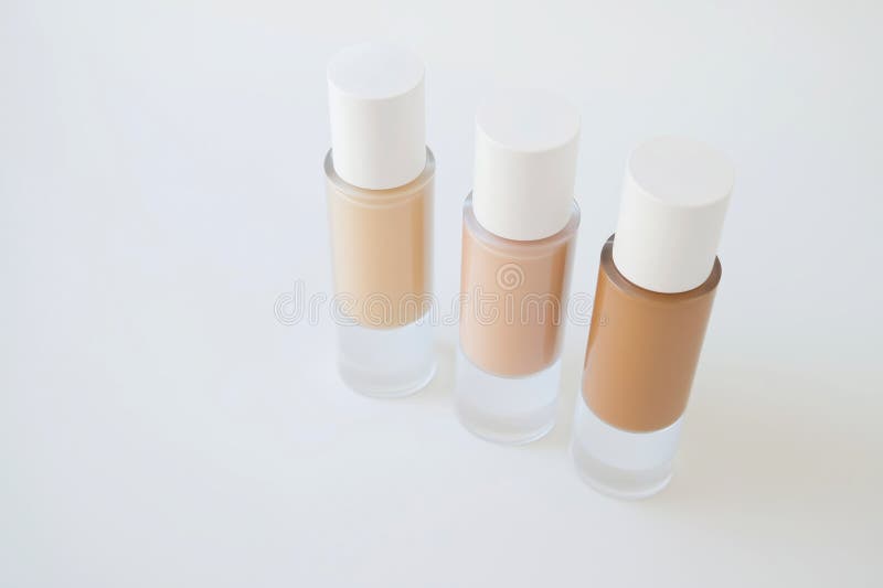 A Collection of Three Foundation Bottles in Different Shades. Stock ...