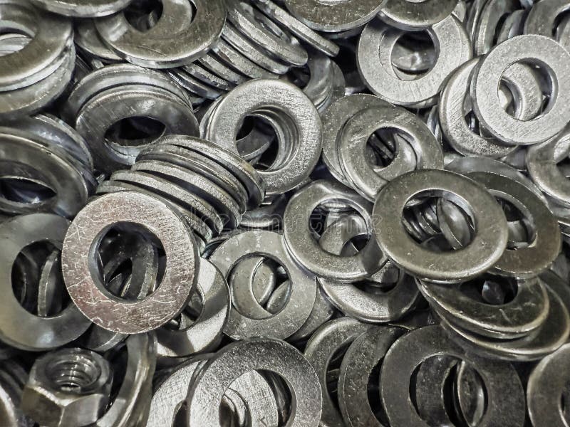A Collection of Various Black Washers Stacked Together in a Hardware ...