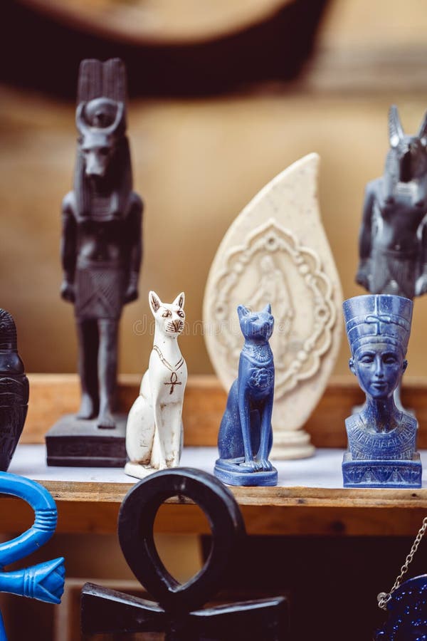 Collection of Various Souvenirs Including Cat Figurines, Ankhs, and ...