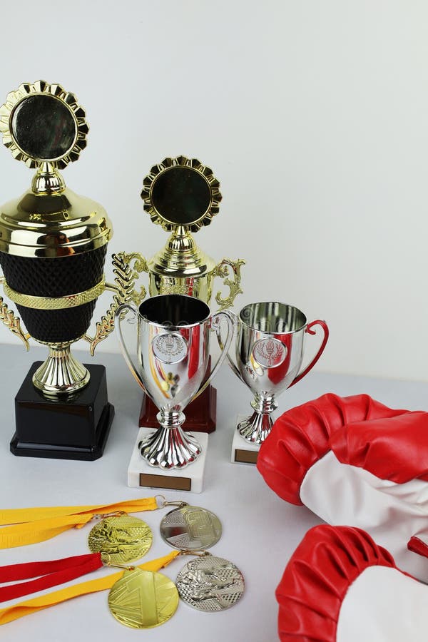 A Collection of Trophies and Medals is Displayed on a Table Stock Photo ...