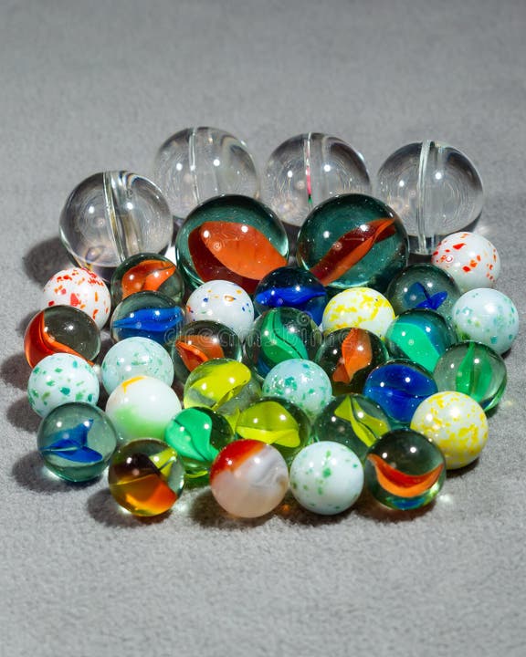 A Collection of Various Types and Sizes of Marbles Grouped Together ...