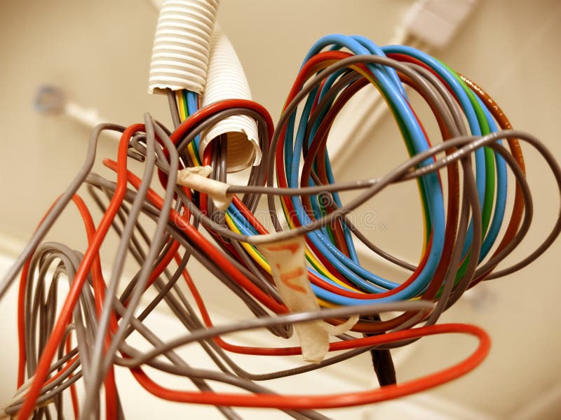 A Collection of Various Wires is Hanging Down from the Ceiling Stock ...