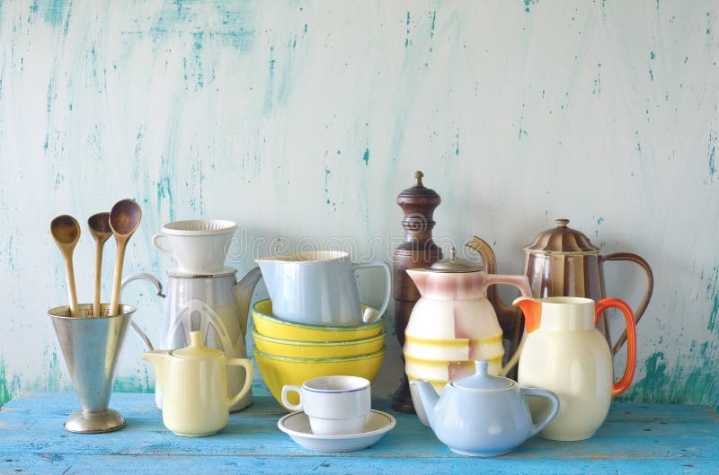 A Set of Vintage Dinnerware: Plate, Crossed Forks and Spoons on a White ...