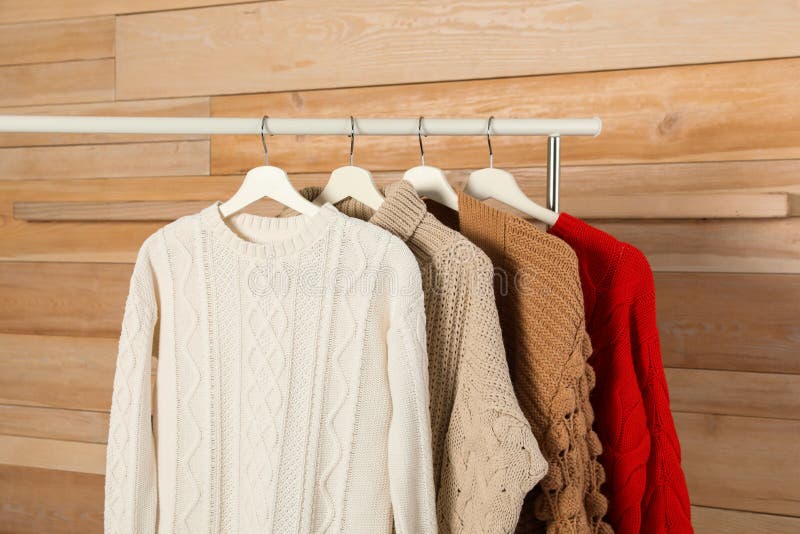 Collection of Warm Sweaters Hanging on Rack Stock Photo - Image of cozy ...