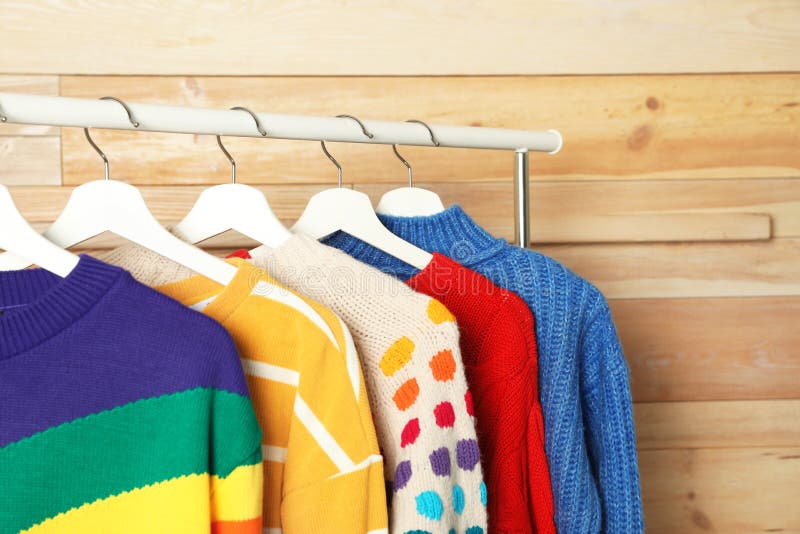 Collection of Warm Sweaters Hanging on Rack Stock Photo - Image of ...
