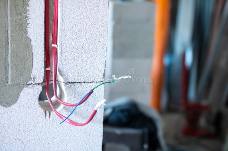 A Collection of Wires is Hanging Down from a Wall Structure Stock Photo ...