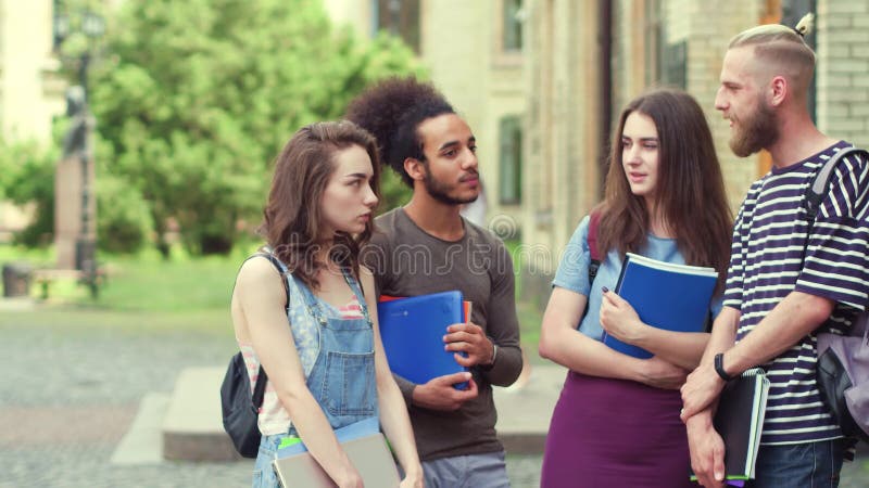 College Friends Standing Talking before University Classes. Stock Video ...
