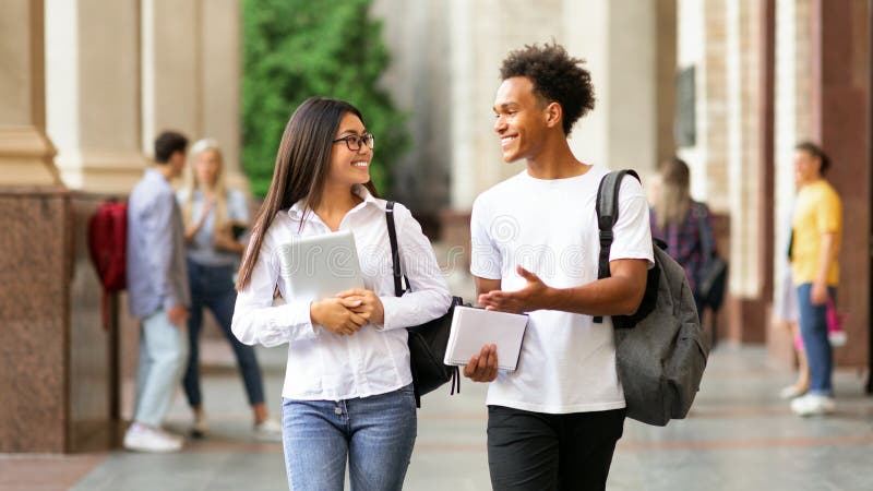 College Friends Walking in Campus and Talking Stock Photo - Image of ...