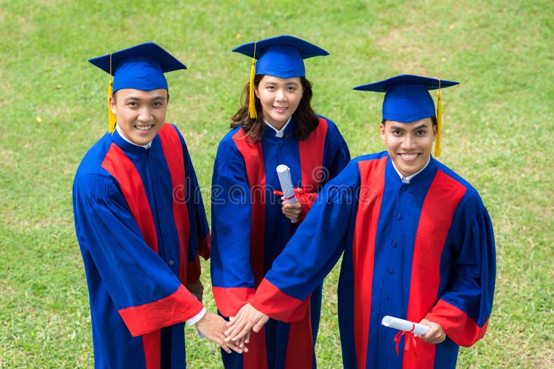 College Graduates Joining Hands Together Stock Image - Image of ...