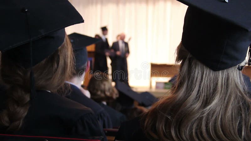 College Headmaster Presenting Graduating Students with Certificates ...