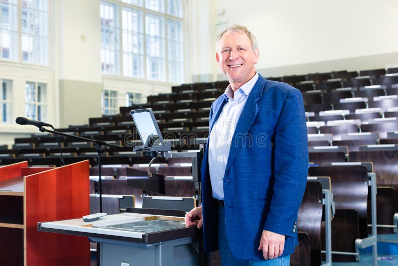 College Professor in Auditorium Stock Photo - Image of male, working ...
