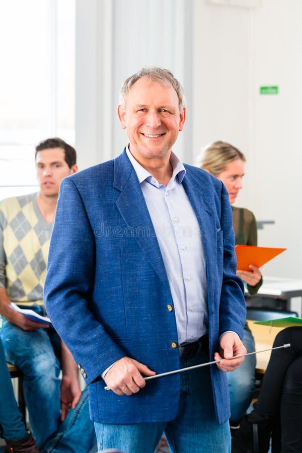 College Professor in Auditorium Stock Photo - Image of male, working ...