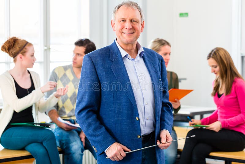College Professor in Auditorium Stock Photo - Image of male, working ...