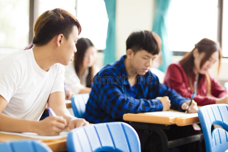 College Student Cheating during Exam Stock Photo - Image of quiz, desk ...