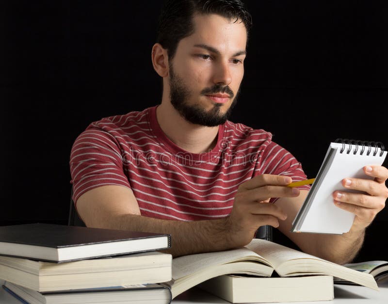 College Student Checking Notes Stock Image - Image of sitting, checking ...