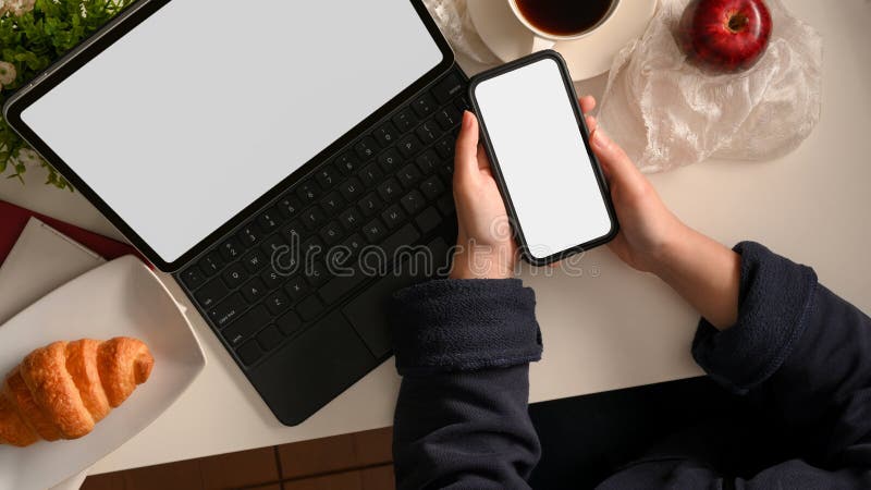 College Student Doing an Assignment with Mock-up Tablet, Smartphone ...