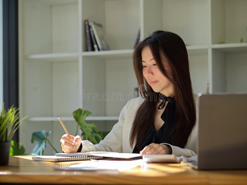 College Student Doing Her Financial Homework Assignment Stock Photo ...