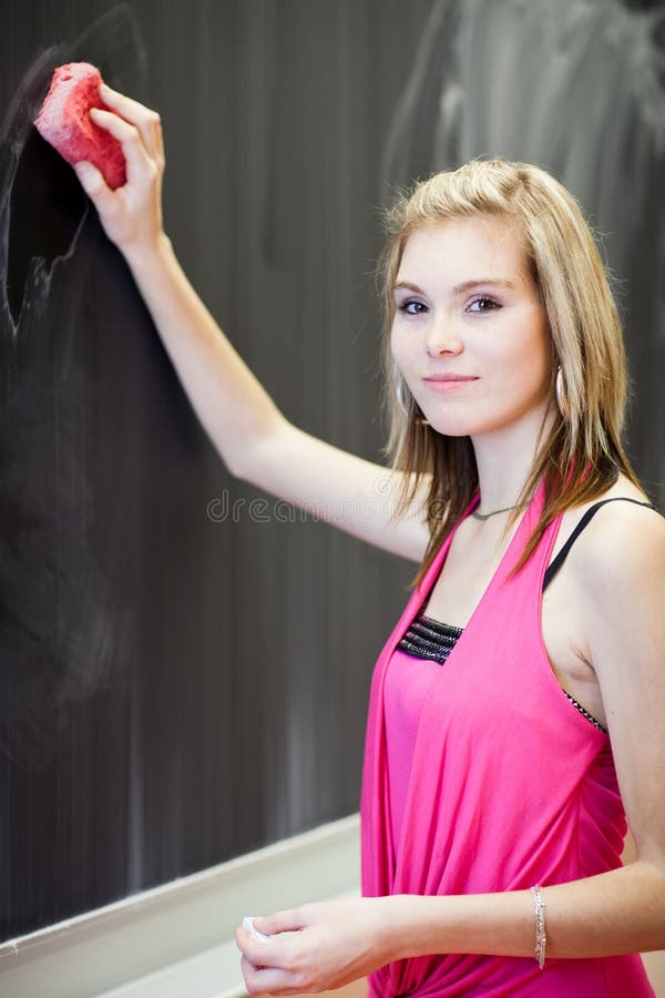 Student Erasing the Chalkboard Stock Image - Image of female, caucasian ...