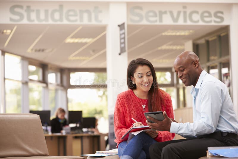 College Student Having Meeting with Tutor To Discuss Work Stock Photo ...