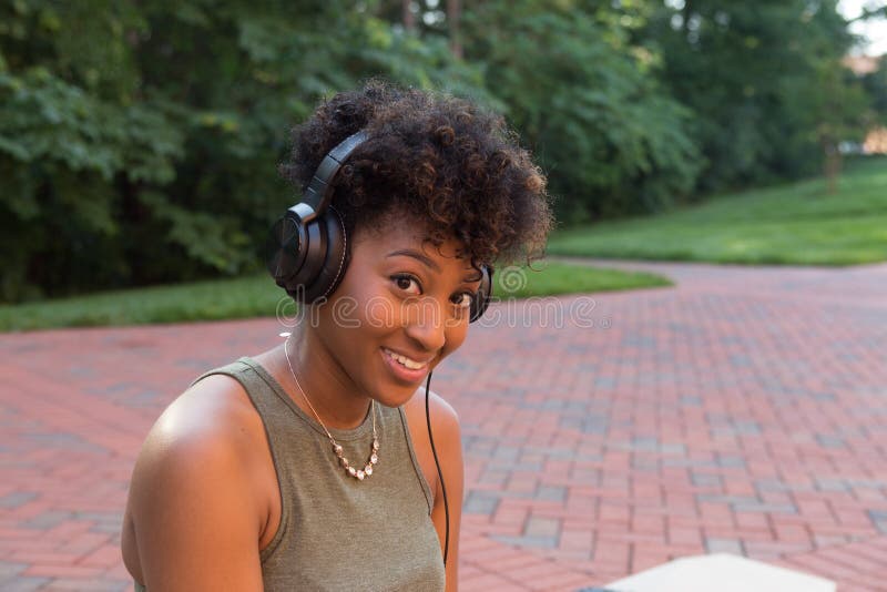 College Student with Headphones Stock Image - Image of campus, ethnic ...