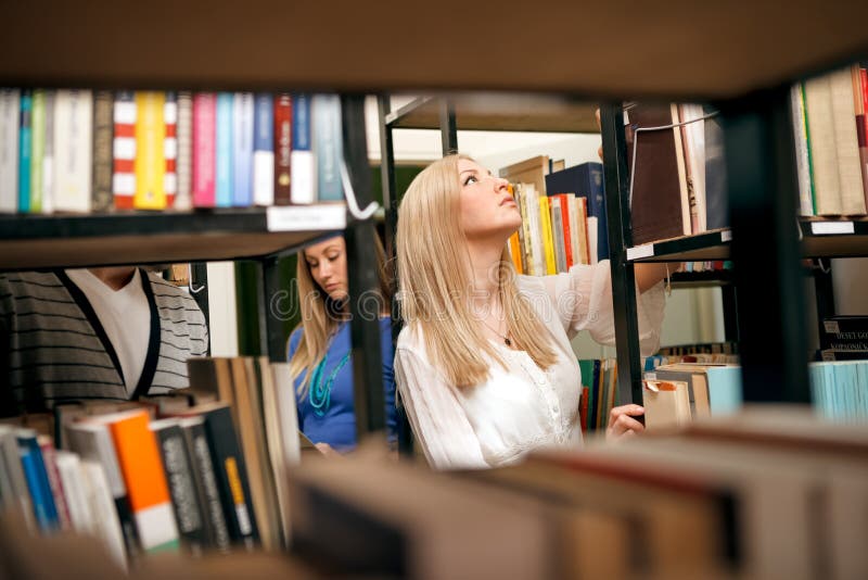 College student in library stock photo. Image of adult - 33256408