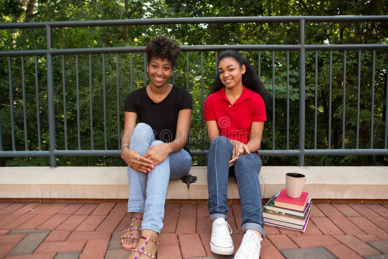2 College Students on Campus Stock Photo - Image of outdoors, cheerful ...