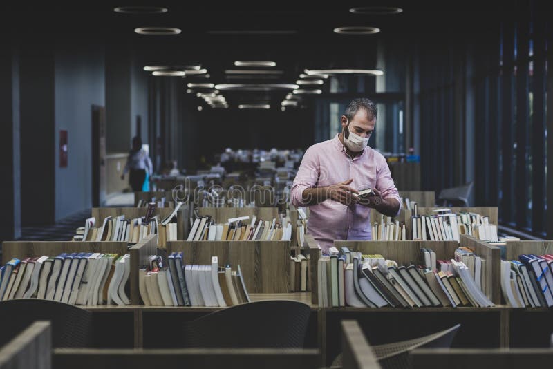 College Student Reading Books in a Library Stock Image - Image of ...