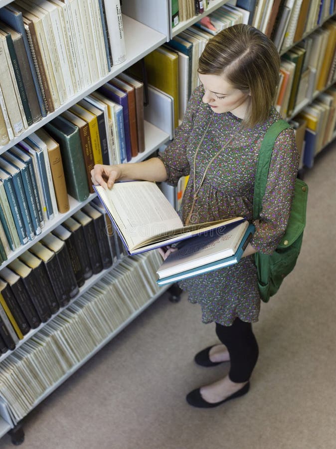 College Student Reading in Library Editorial Photography - Image of ...