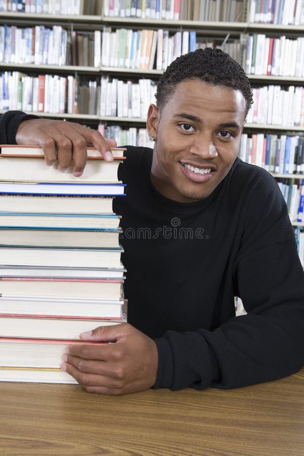 College Student Sitting with Stack of Books Stock Image - Image of ...