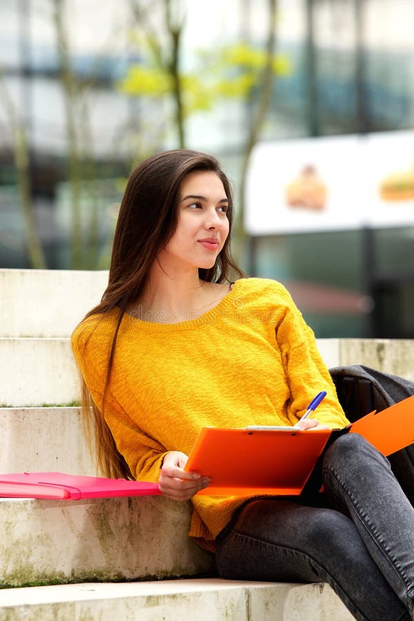 College Student Sitting on Steps with Notebook Stock Photo - Image of ...
