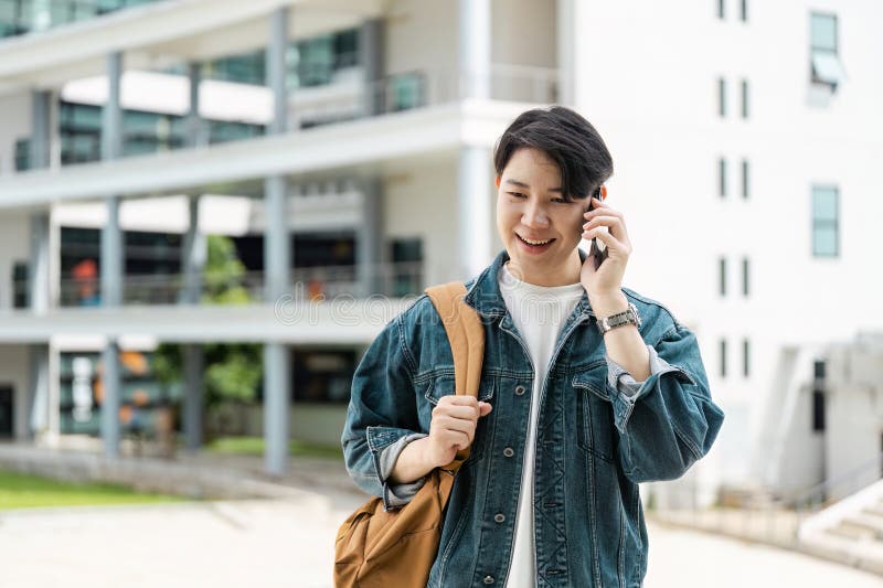 College Student Talking on Phone Outdoors with Backpack in Modern ...