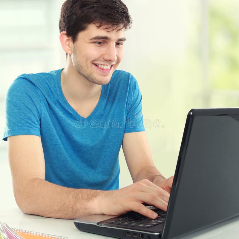 Smiling Guy Using Laptop Computer Stock Photo - Image of adult, indoors ...