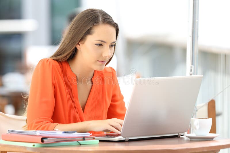 College Student Using a Laptop in a Coffee Shop Stock Photo - Image of ...