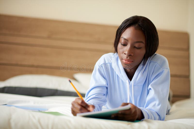 College Student Writing Essay Stock Photo - Image of room, zoomer ...