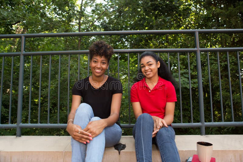2 College Students on Campus Stock Photo - Image of outdoors, cheerful ...
