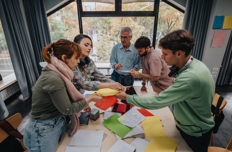 College Students Collaborating with Professor in Modern Classroom ...