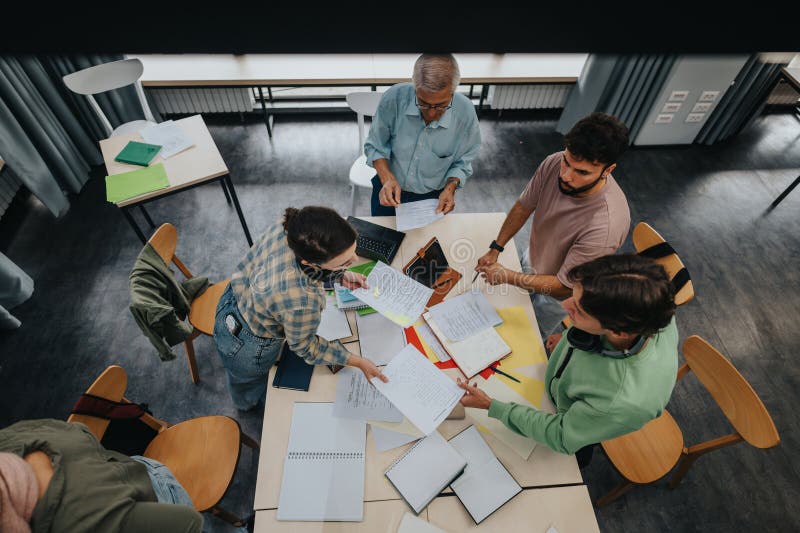 College Students Collaborating with Professor in Modern Classroom ...