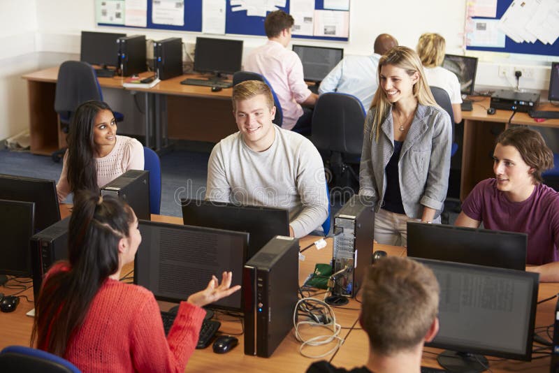 Teacher Helping Students Training To Work in Catering Stock Photo ...