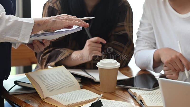 College Students Discussing with Professor during Class. Education ...
