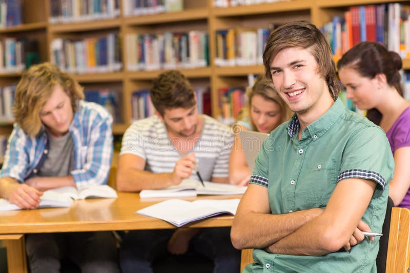 College Students Doing Homework in Library Stock Photo - Image of ...