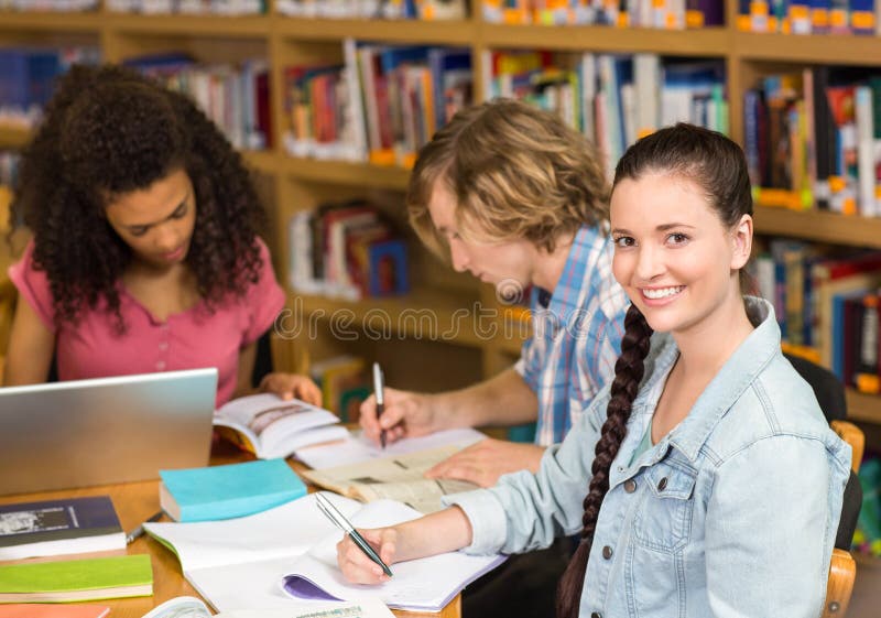 College Students Doing Homework in Library Stock Photo - Image of adult ...