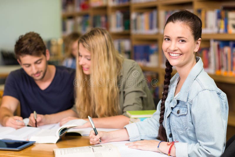 College Students Doing Homework in Library Stock Photo - Image of adult ...