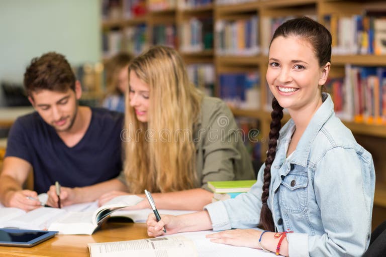 College Students Doing Homework in Library Stock Photo - Image of adult ...