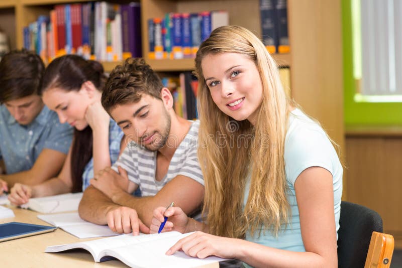 College Students Doing Homework in Library Stock Photo - Image of ...