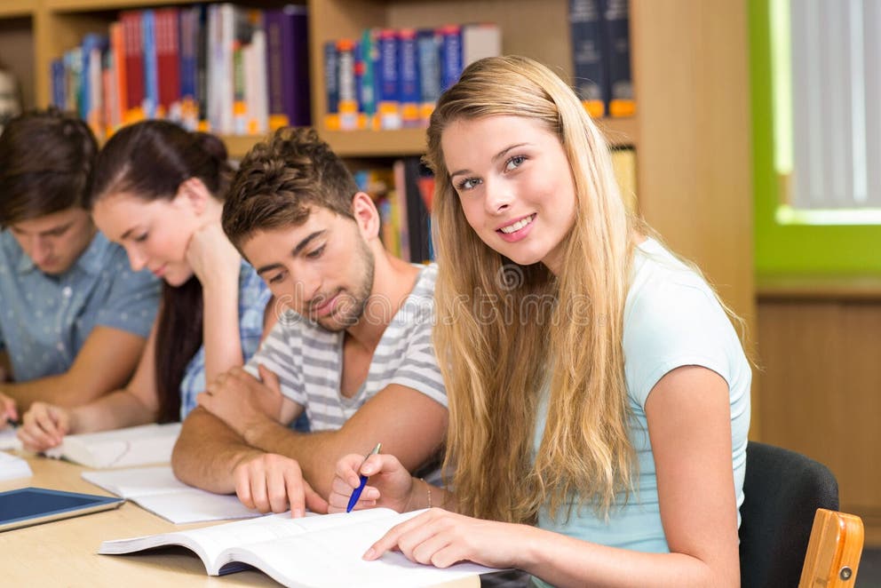 College Students Doing Homework in Library Stock Photo - Image of ...