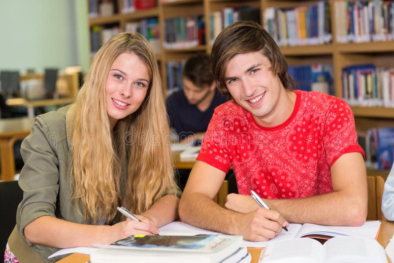 College Students Doing Homework in Library Stock Photo - Image of front ...