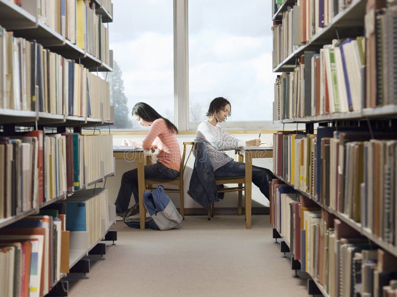 College Students Doing Homework in Library Stock Photo - Image of ...