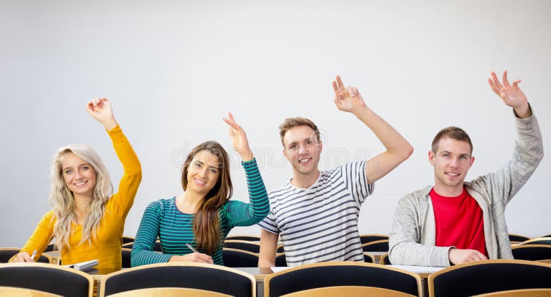 College Student Raising Hand In Class