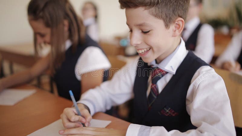 College Students in School Uniform Write Certification Work. Test of ...